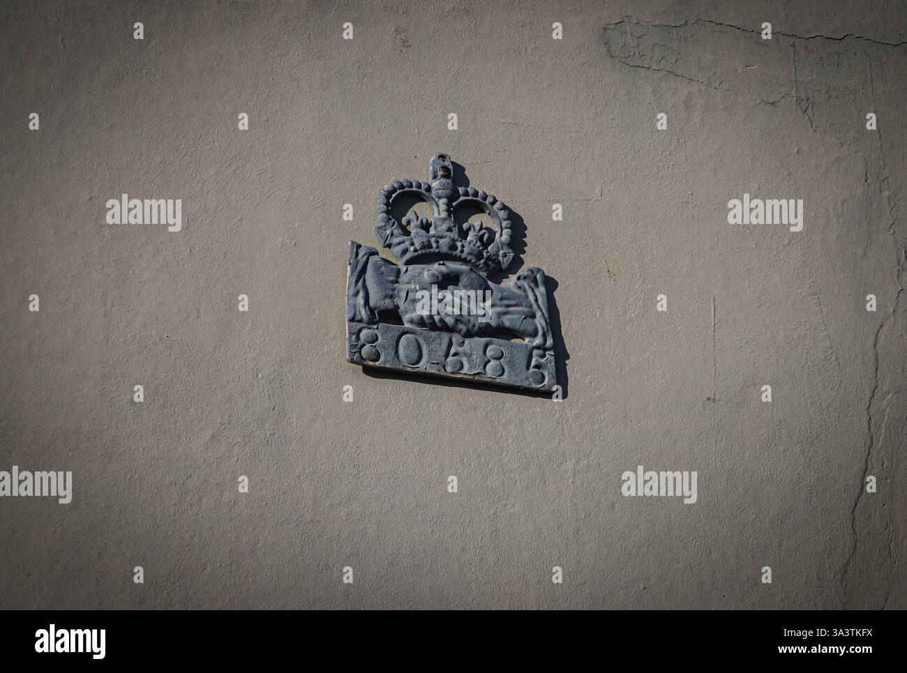 Lead ‘fire mark’ depicting two hands beneath a crown, used in C18th to ...