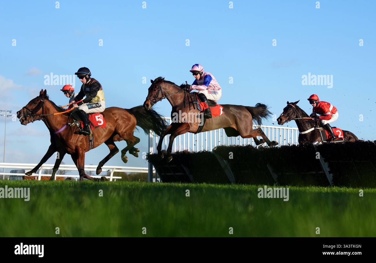 Kateira (centre) ridden by Harry Skelton on their way to winning the Racing TV Mares' Hurdle at ...