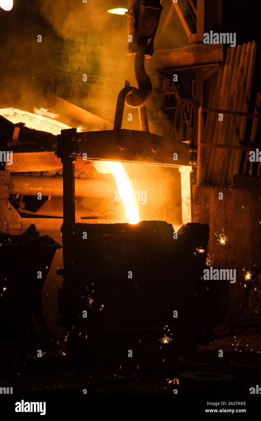 Metallurgist pouring hot molten hi-res stock photography and images - Alamy