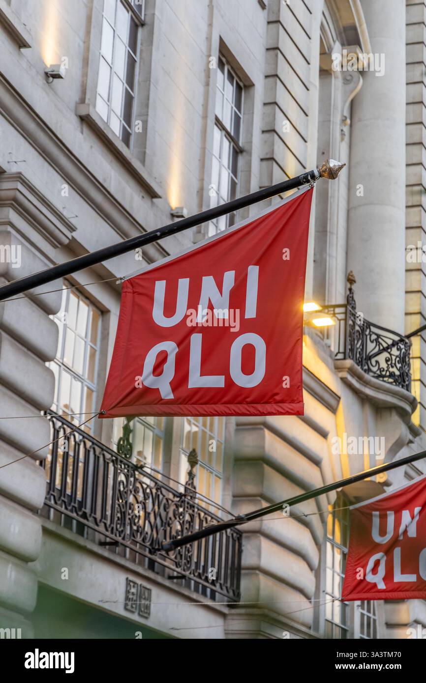 London, UK- September 19, 2024: UNIQLO Japanese shop logo red flag store in London Regent street ...