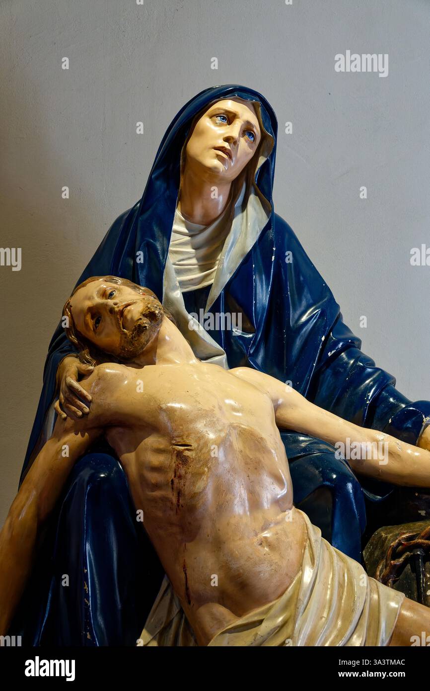 Paris, FRANCE - 08–01-2024: Statue of The Pietà. Blessed Virgin Mary holding Jesus Christ body ...
