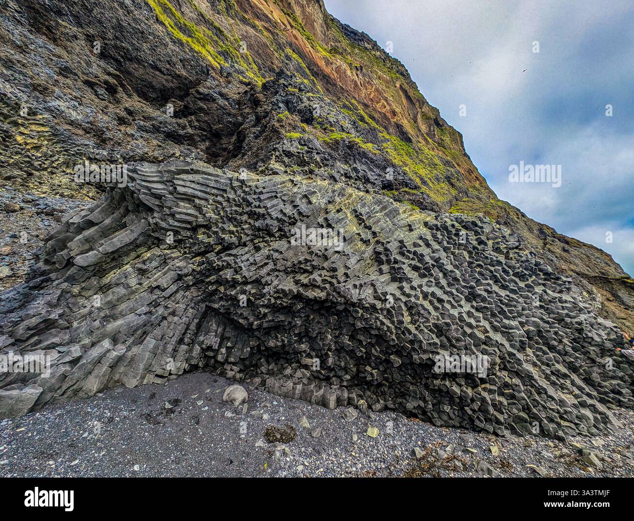 Stack of basalt columns by Halsanefshellir cave on Reynisfjara black sand beach in Iceland Stock ...