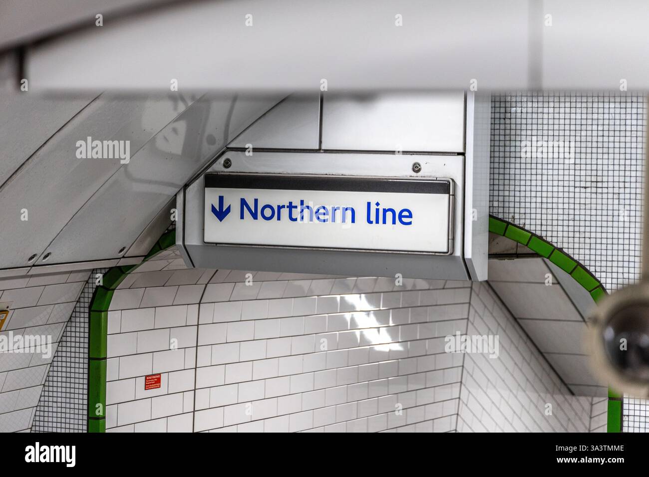 London, UK- September 19, 2024: White tile walls with a clear direction ...