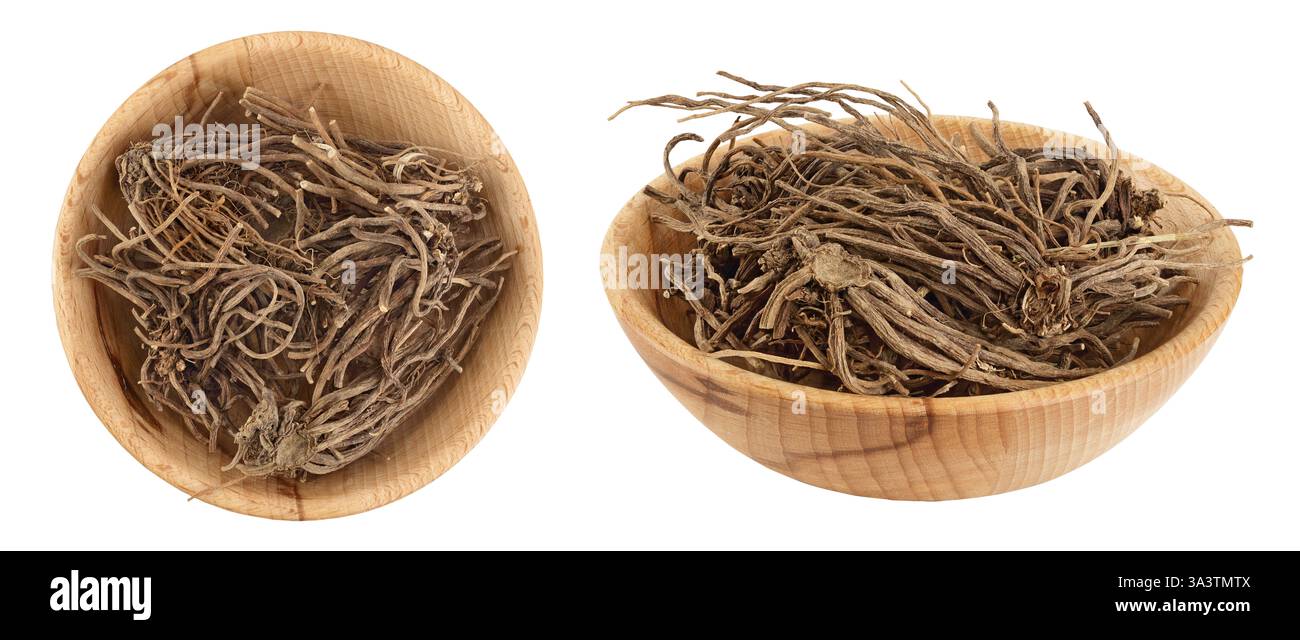 Dried Valerian root in wooden bowl isolated on white background ...