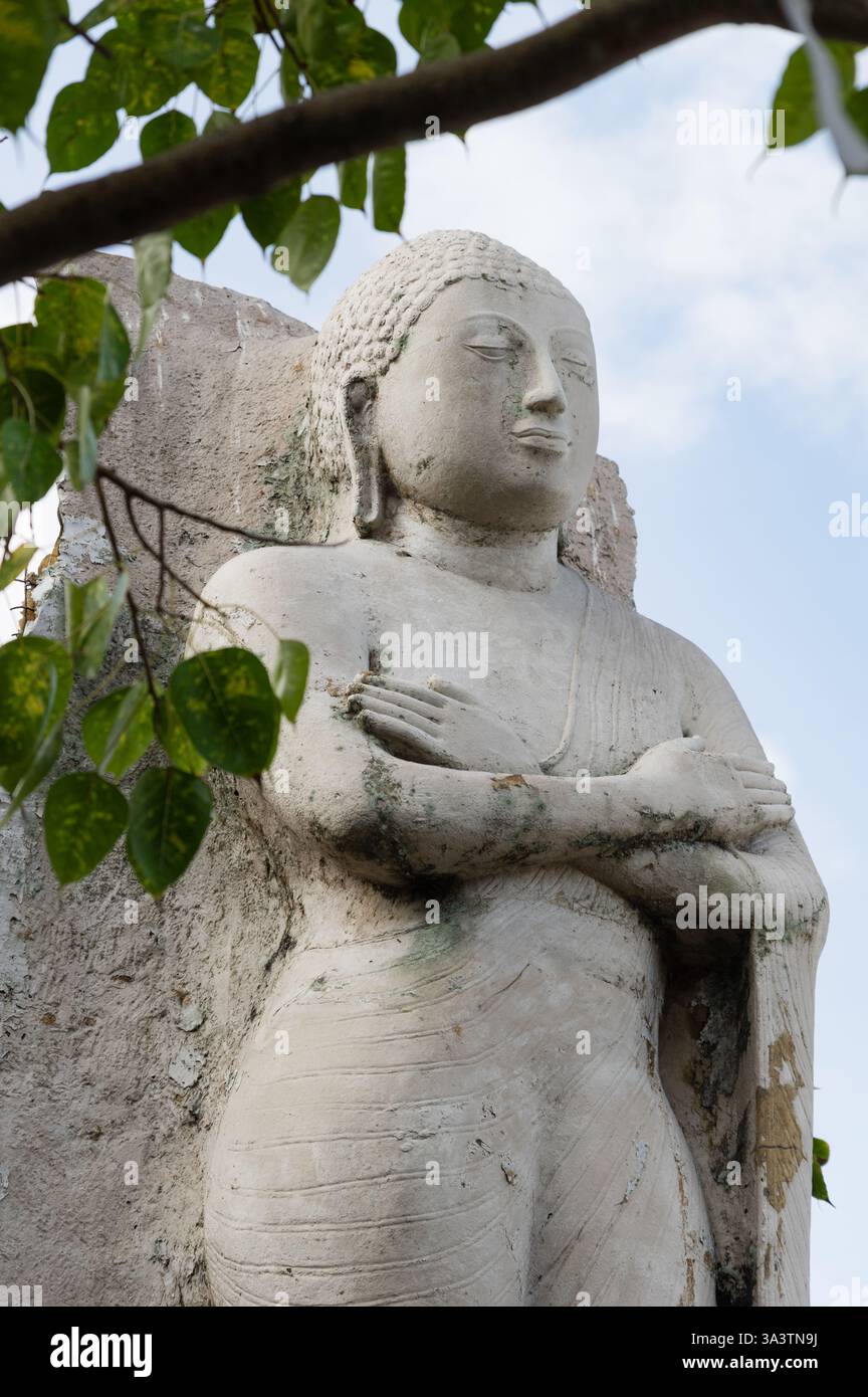 Carved stone Buddha statue at Gangaramaya temple, Sri Lanka Stock Photo ...