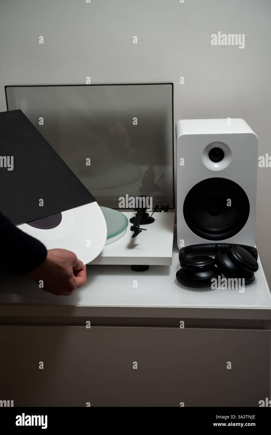 Vinyl LP tracks with modern needle player. Musician changes vinyl ...