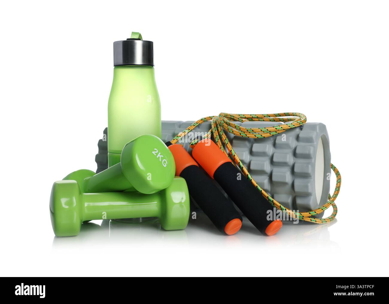 Dumbbells, foam roller, skipping rope and bottle of water isolated on ...