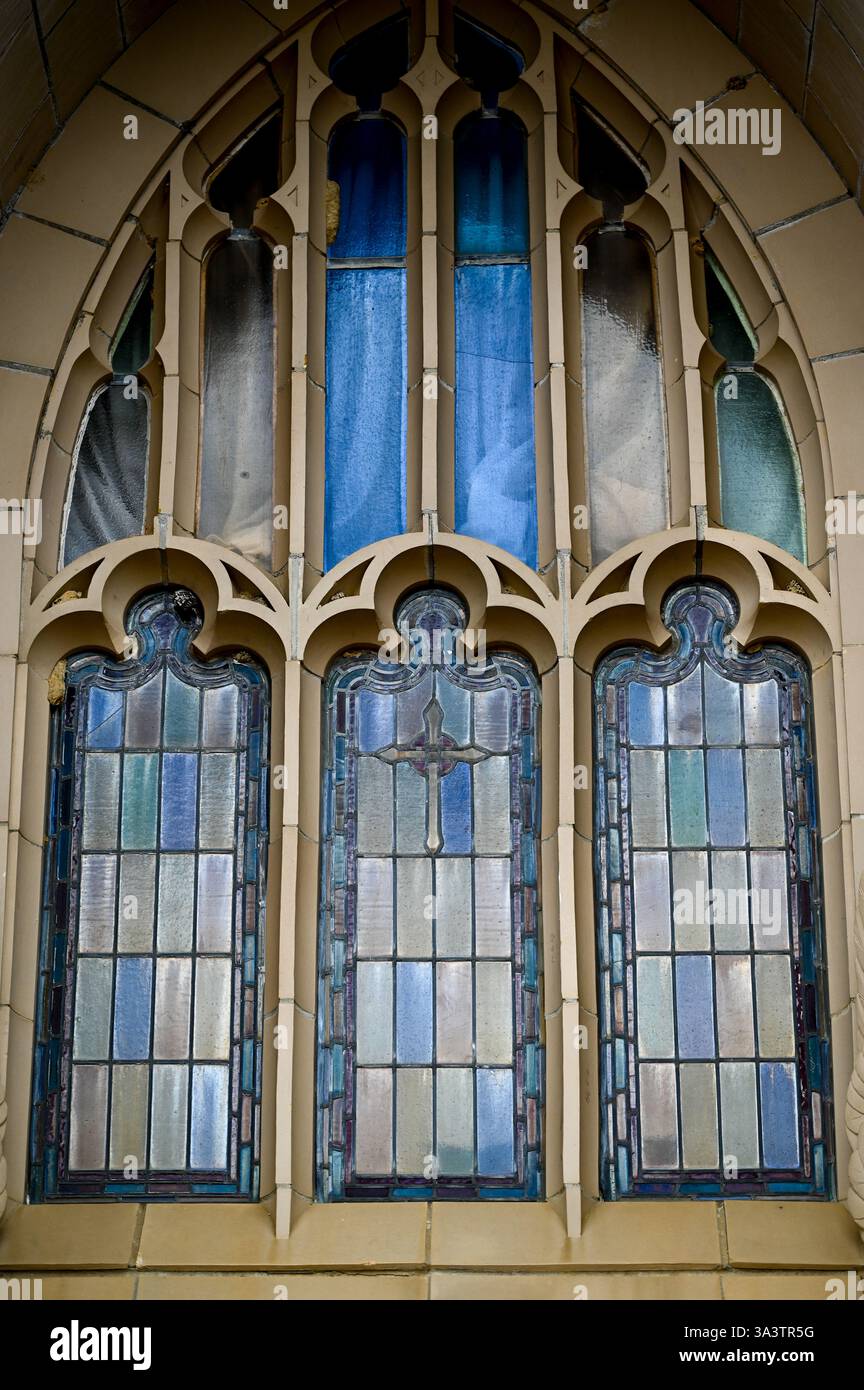 Tudor and gothic revival style arched stained glass window Stock Photo - Alamy
