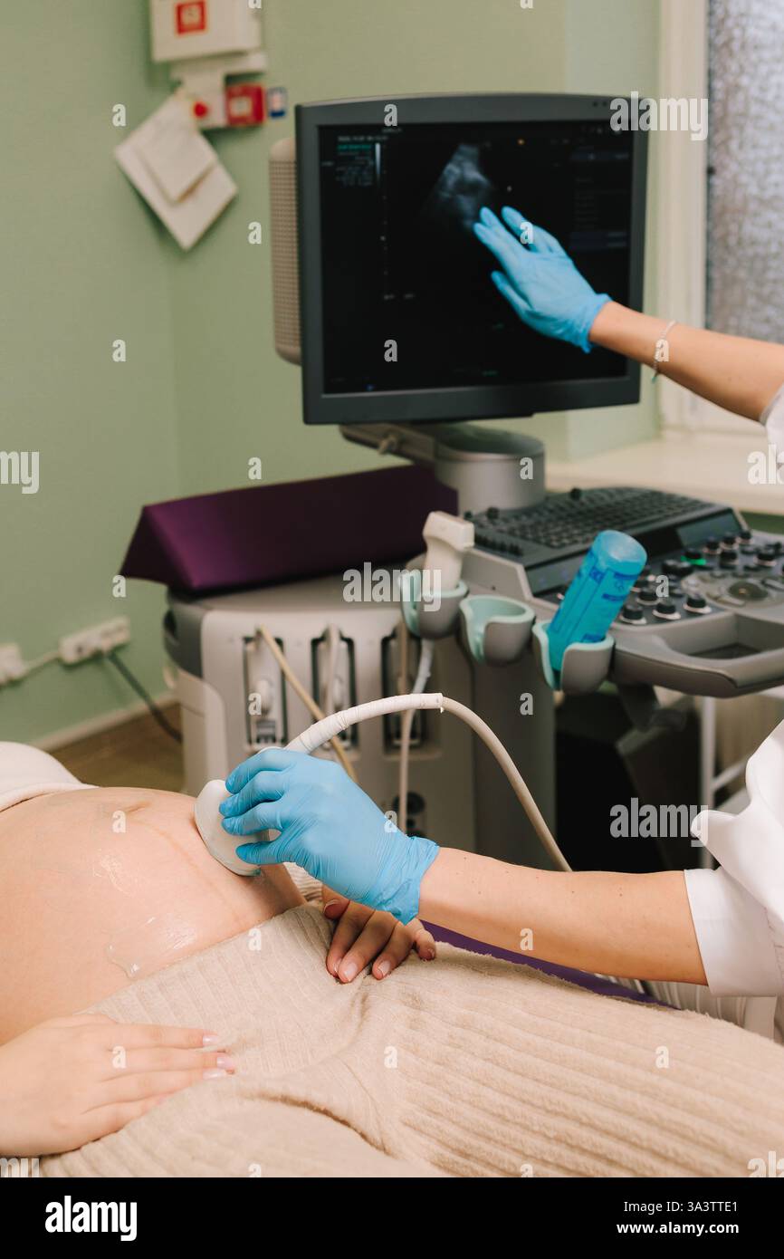 Checking fetus health at the gynecology hospital. Gynecologist uses ...