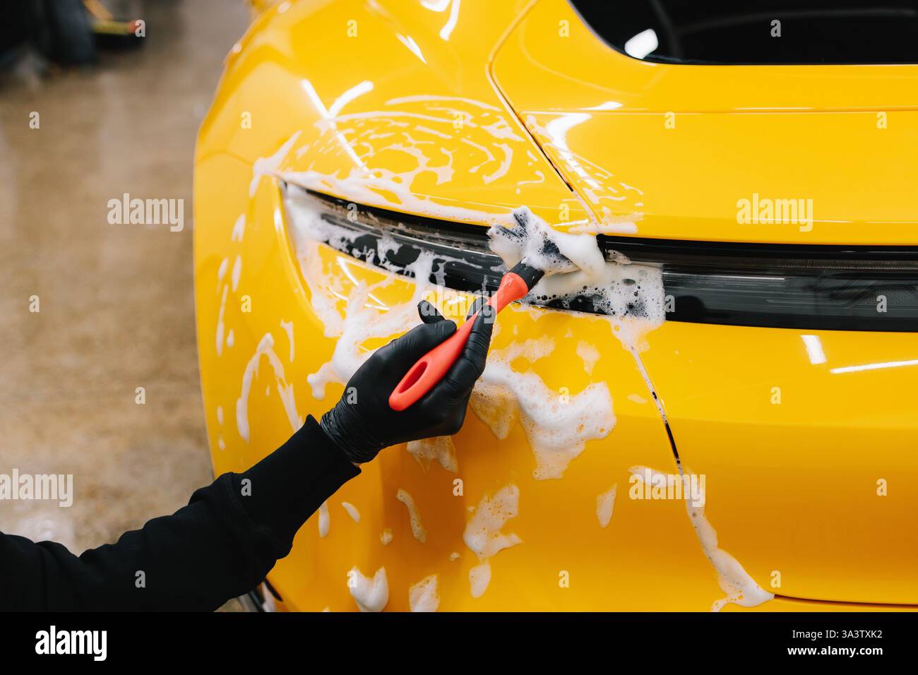 Detailing cleaning with brush and foam at the car wash. Procedure of ...