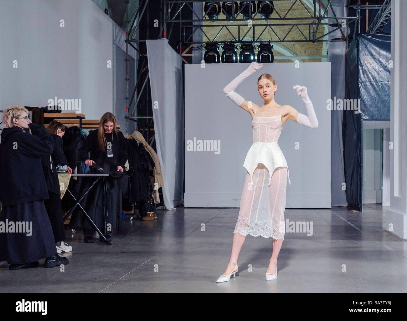 Kyiv, Ukraine - 14th February 2025, a model wows the audience backstage ...