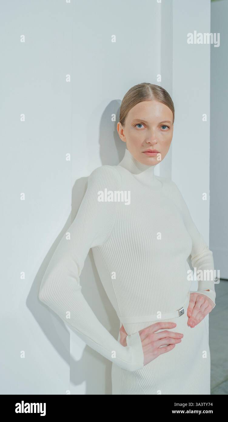 Kyiv, Ukraine - 14th February, 2025. A model poses confidently in a stunning white, fitted ...