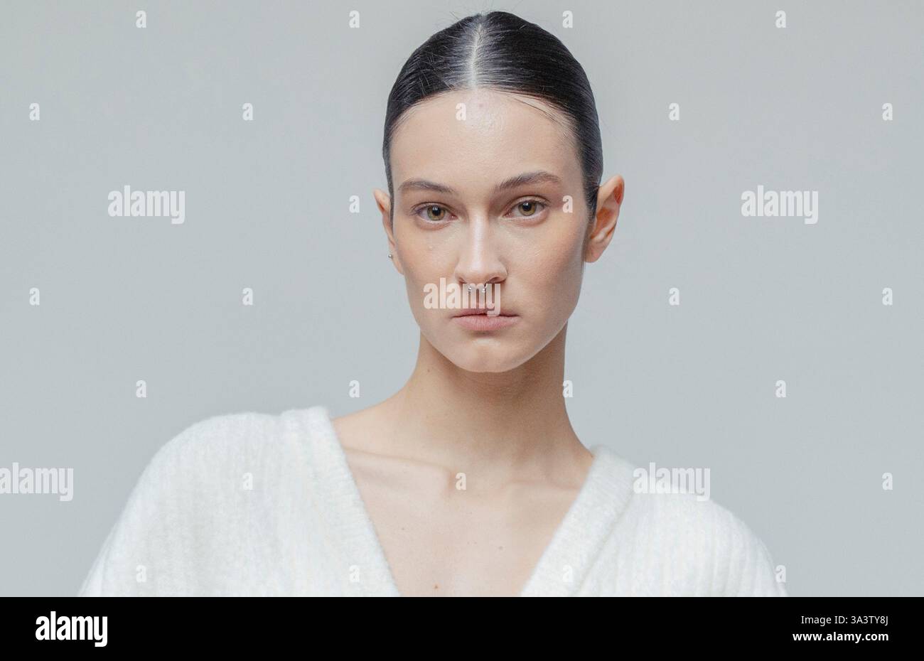 kyiv, ukraine - 14th february, 2025 a model in a white v-neck garment ...