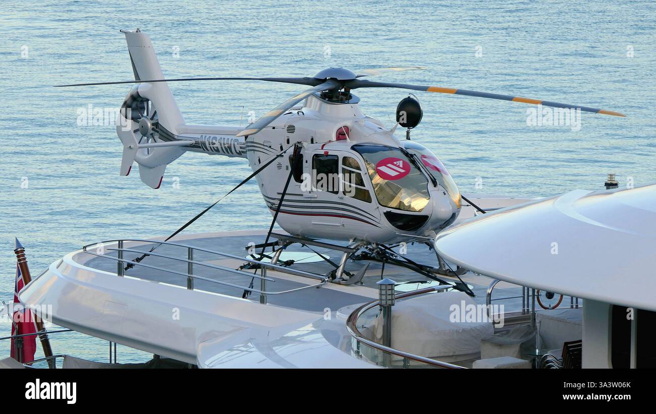 A private helicopter on the helipad of a huge yacht in the Caribbean ...