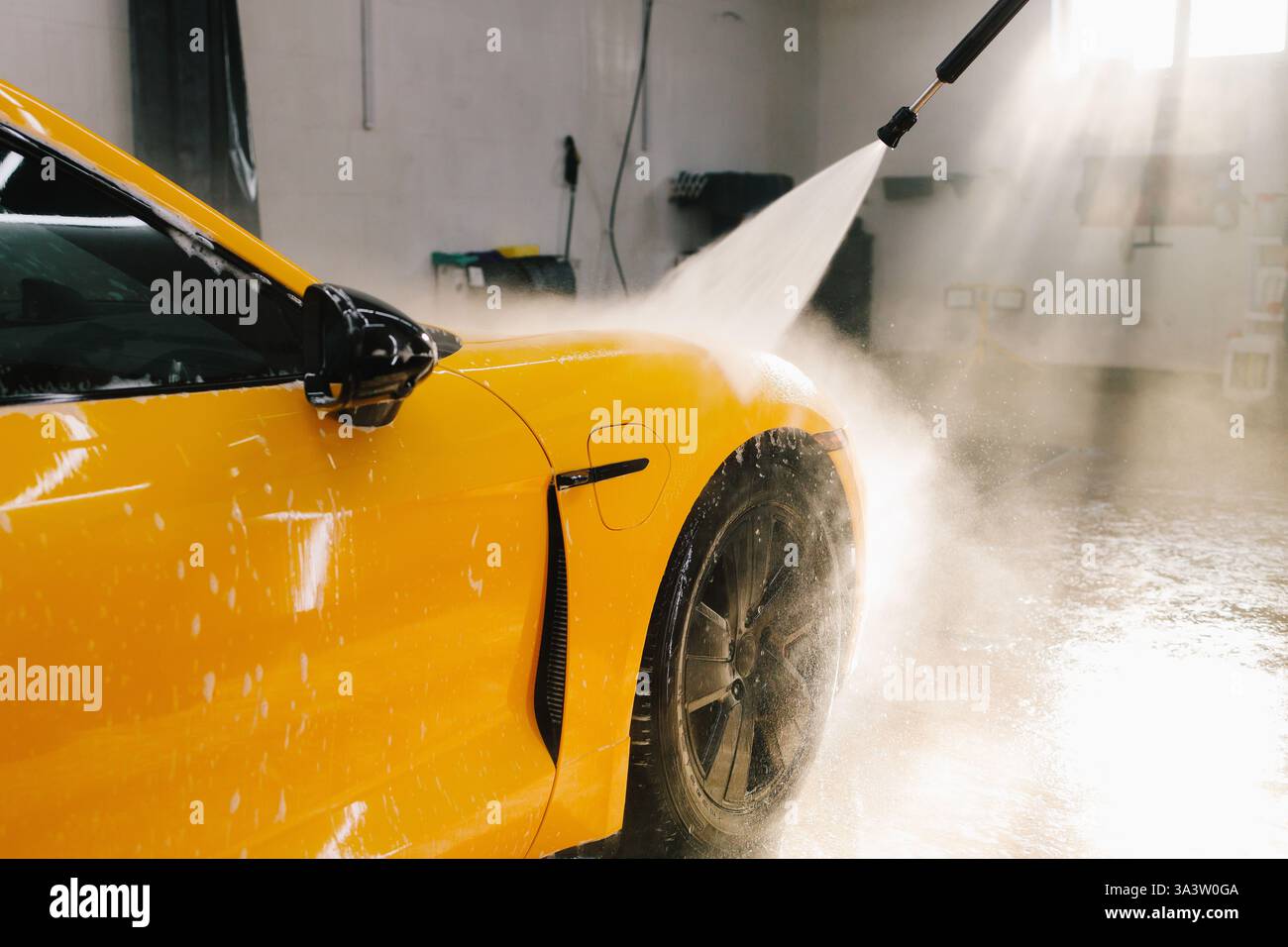 Detailing process of washing car from water gun at the car wash ...