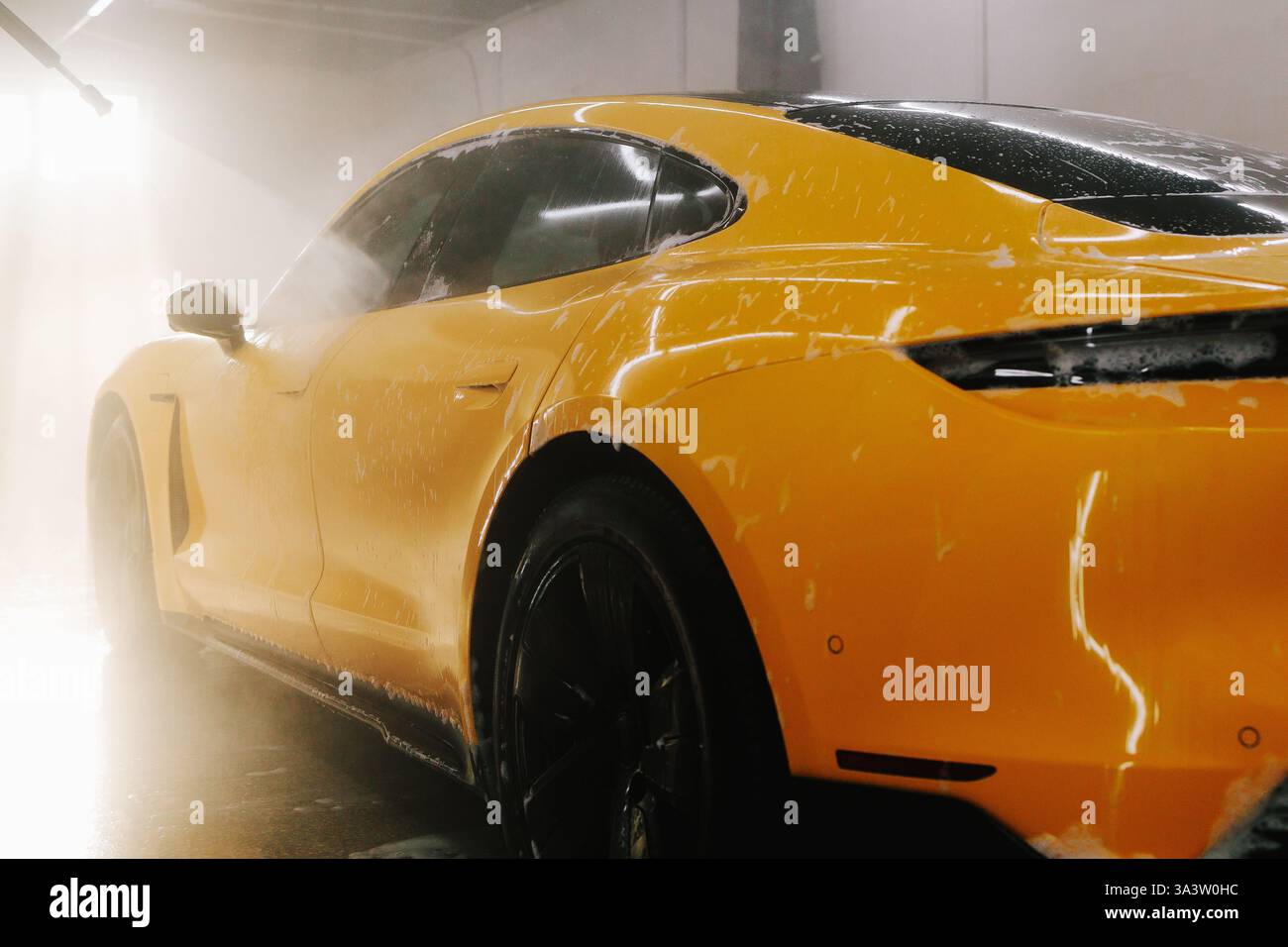 Detailing process of washing car from water gun at the car wash ...