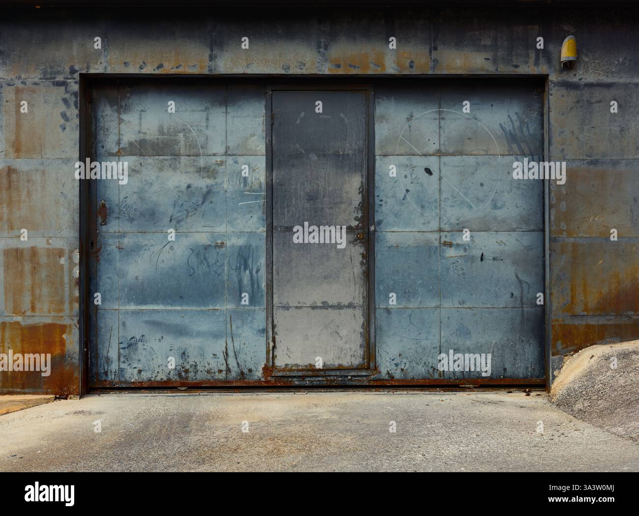 The Vault. Rough untreated corroded steel sliding doors having ...
