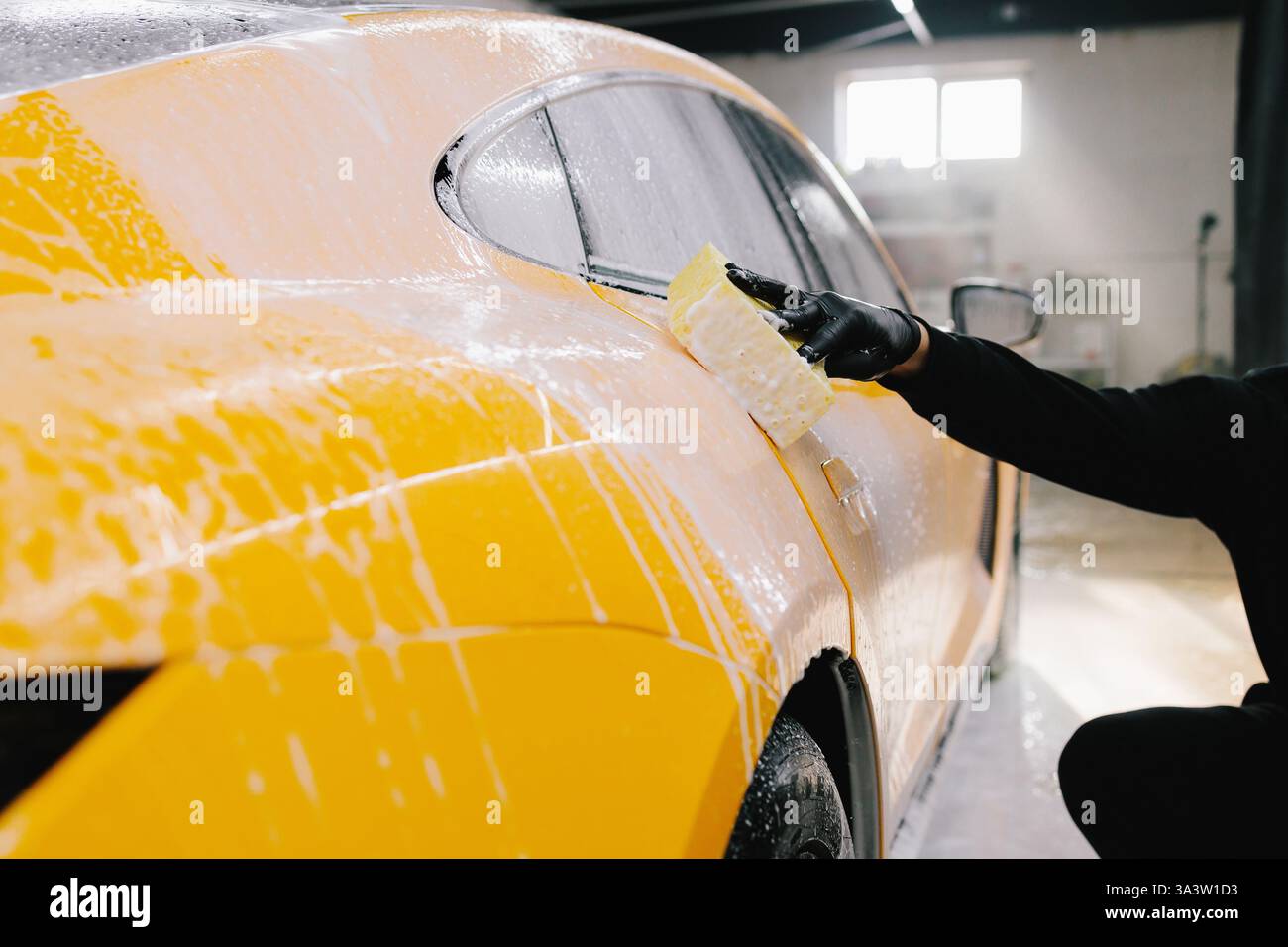 Procedure of washing car with soap solution before auto detailing ...