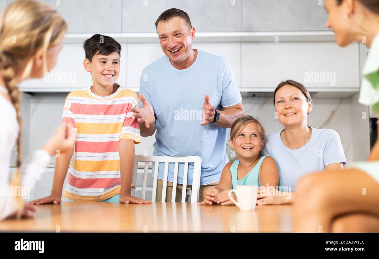 Big family discussing Stock Photo - Alamy