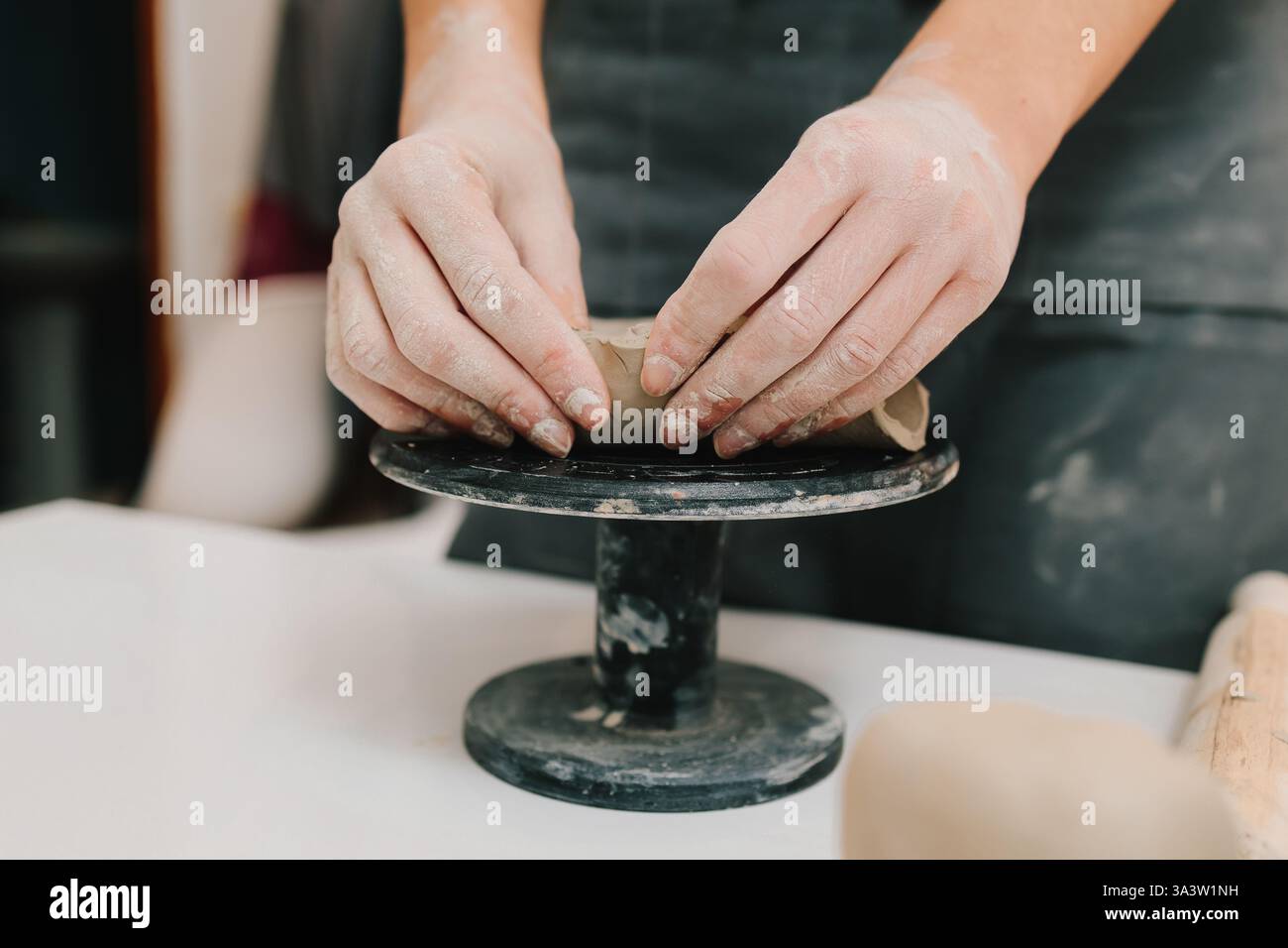 Artisan sculpts ceramic bowl using potter's wheel. Hands shaping clay ...