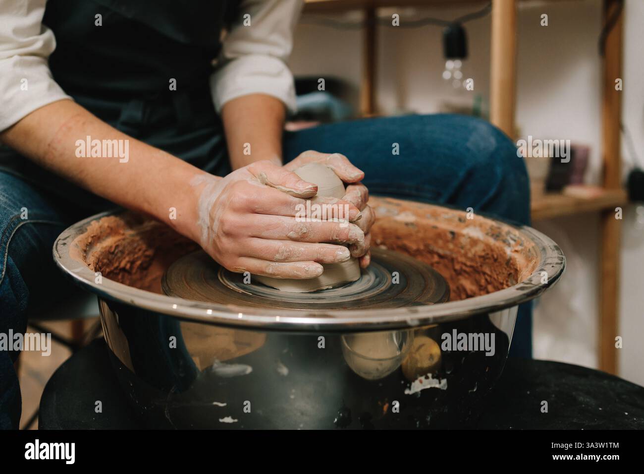Process of making ceramic earthenware on the spinning wheel in the ...