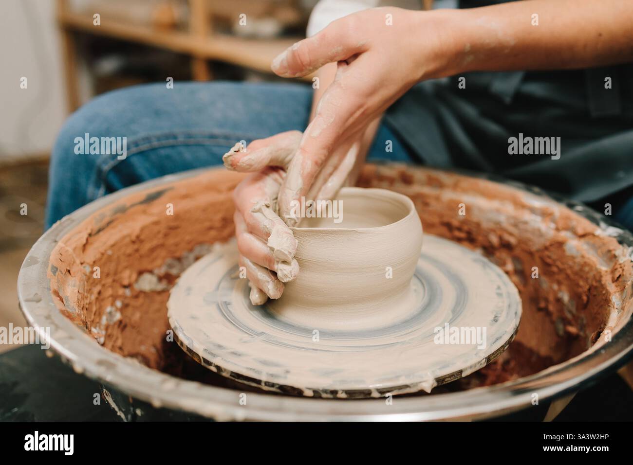 Potter creates a ceramic bowl in the pottery studio. Process of making ...