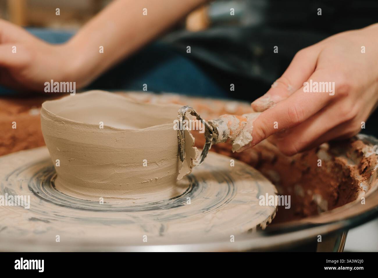 Creating ceramic earthenware on the manufacturing. Artisan forms clay ...