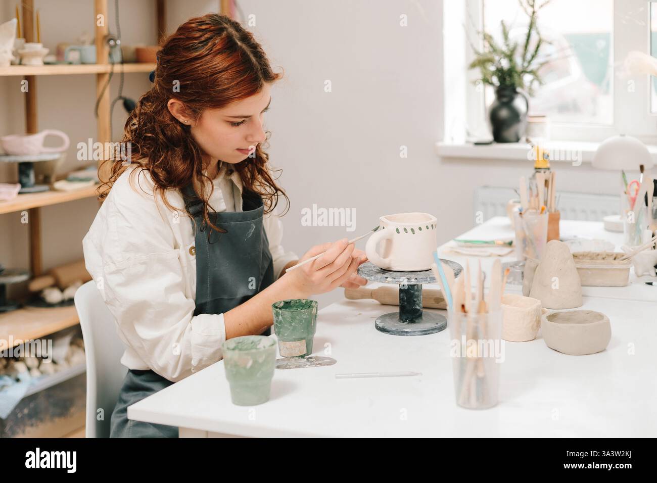 Process of designing cup with a traditional pattern in pottery art ...