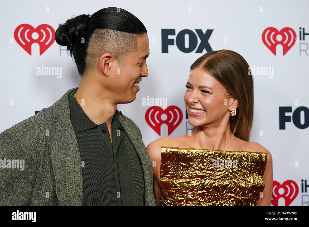 Daniel Wai, left, and Ariana Madix arrive at the iHeartRadio Music ...