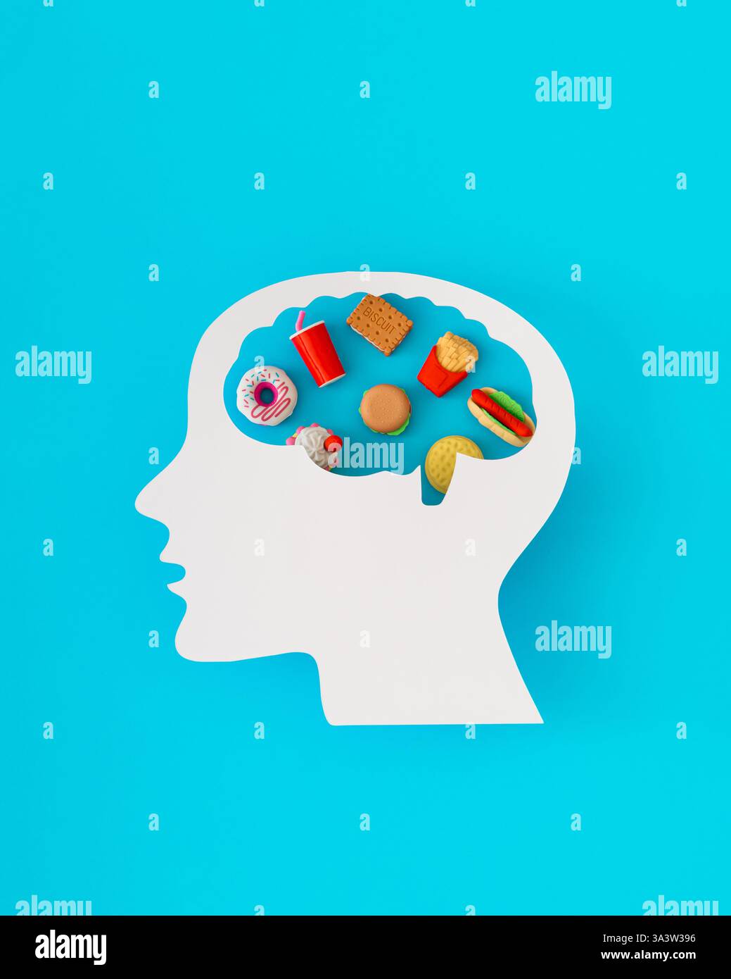 Food products visible through a head profile with brain paper cutout on ...