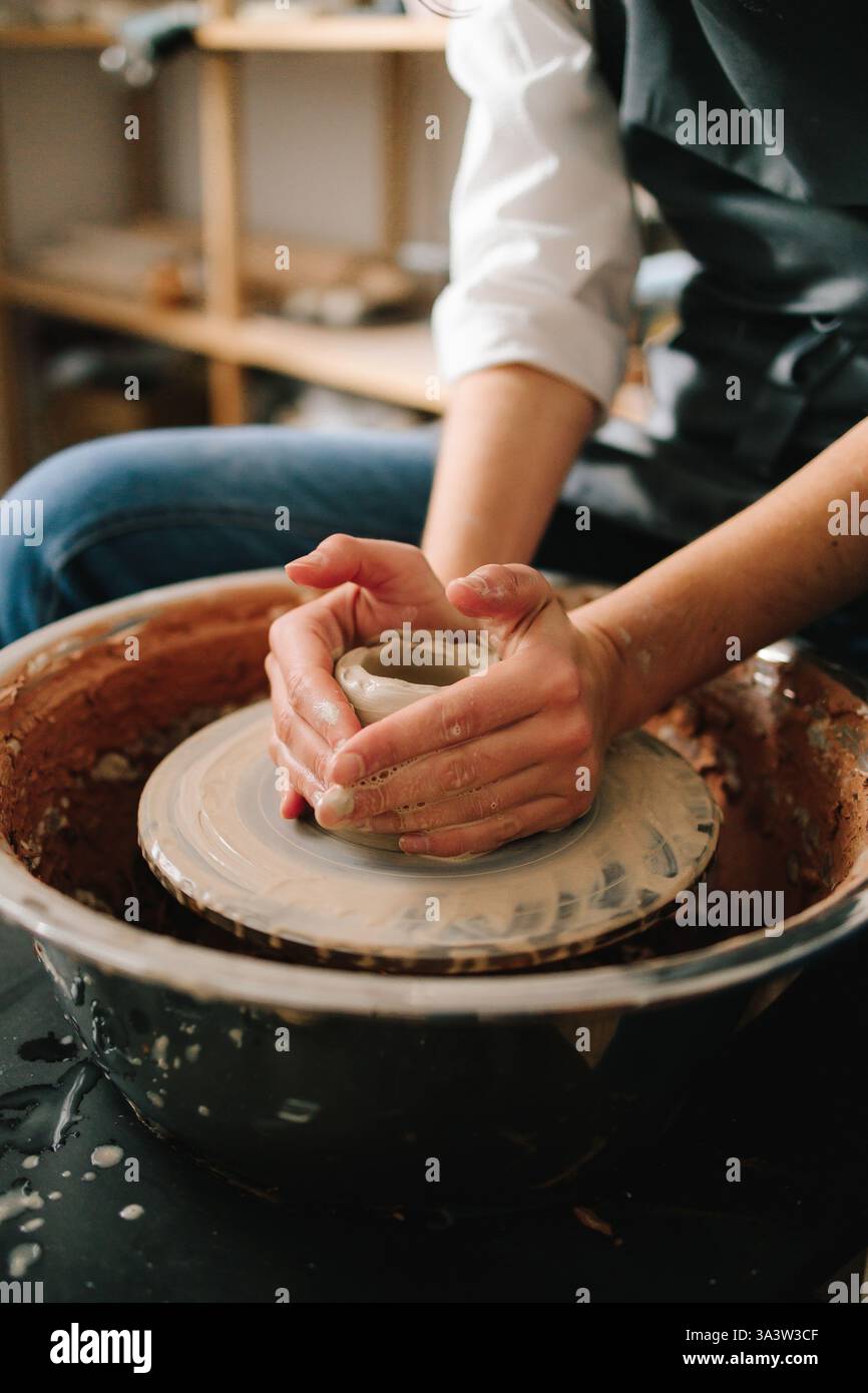Process of making a unique ceramic shape. Potter creates a ceramic bowl ...