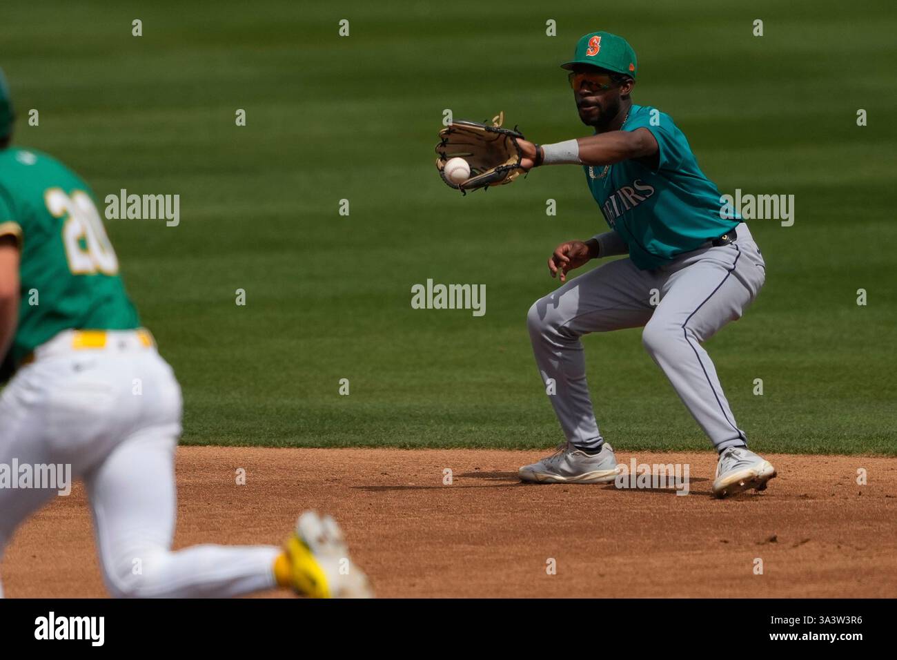 Seattle Mariners' Ryan Bliss field a ground out hit by Athletics' C.J ...