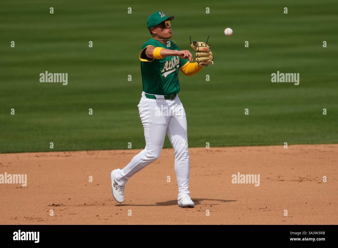 Athletics' Gio Urshela throws out Seattle Mariners' Ryan Bliss on a ...