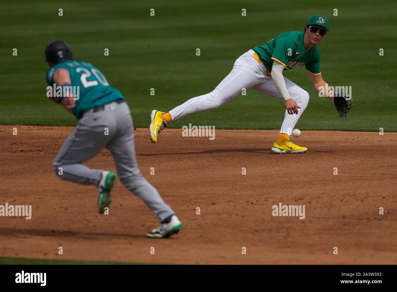Athletics' Zack Gelof fields a ground out hit by Seattle Mariners ...