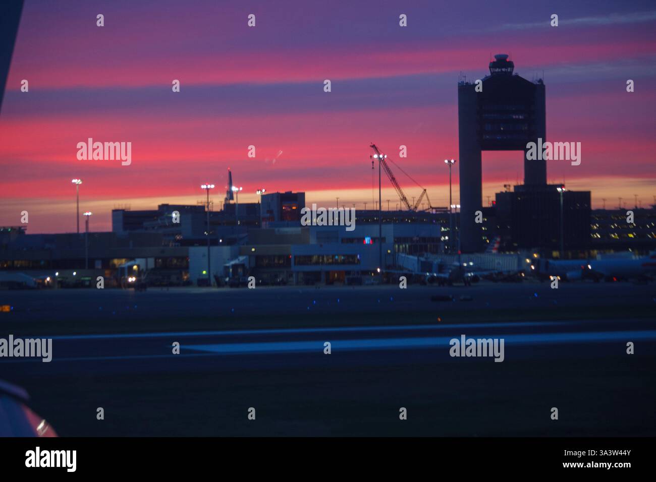 The Air traffic control tower and the beautiful sky colors in Logan ...
