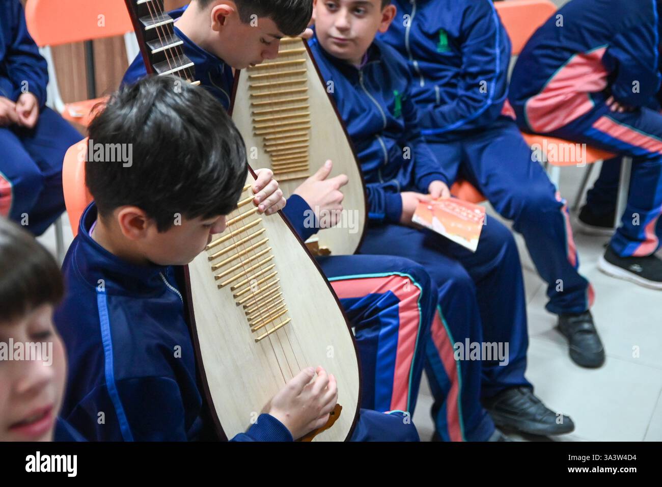 Qormi, Malta. 17th Mar, 2025. Students learn to play pipa during a pipa ...