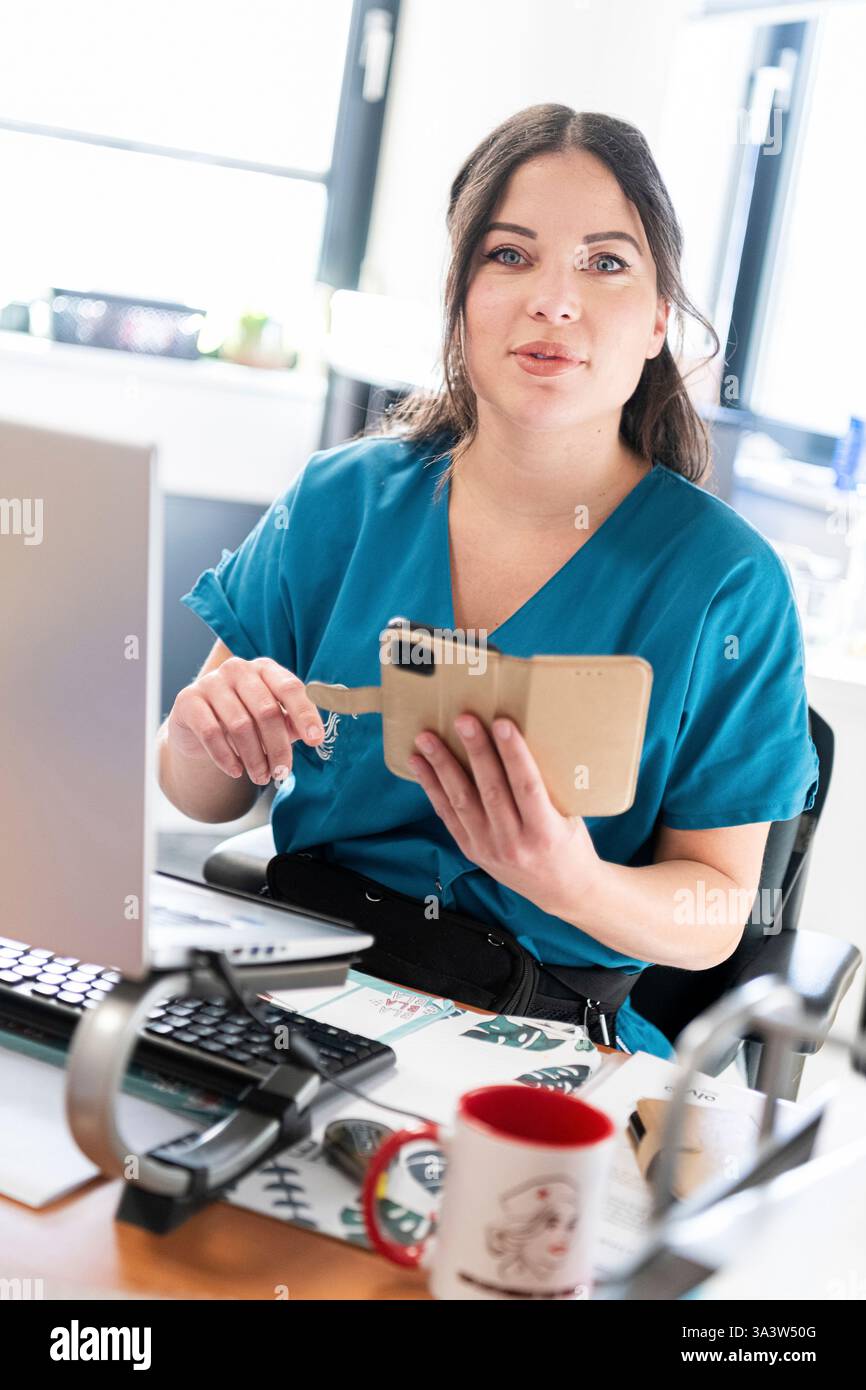 Homecare nurse doing administrative tasks Stock Photo - Alamy