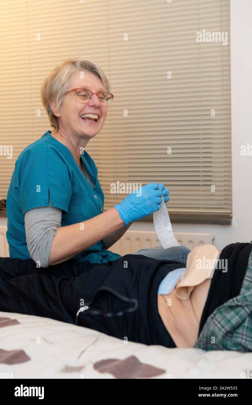 Homecare nurse treating patient with a stoma Stock Photo - Alamy