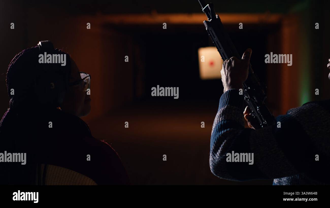 Man holds rifle, enjoying recreational shooting experience in firing ...