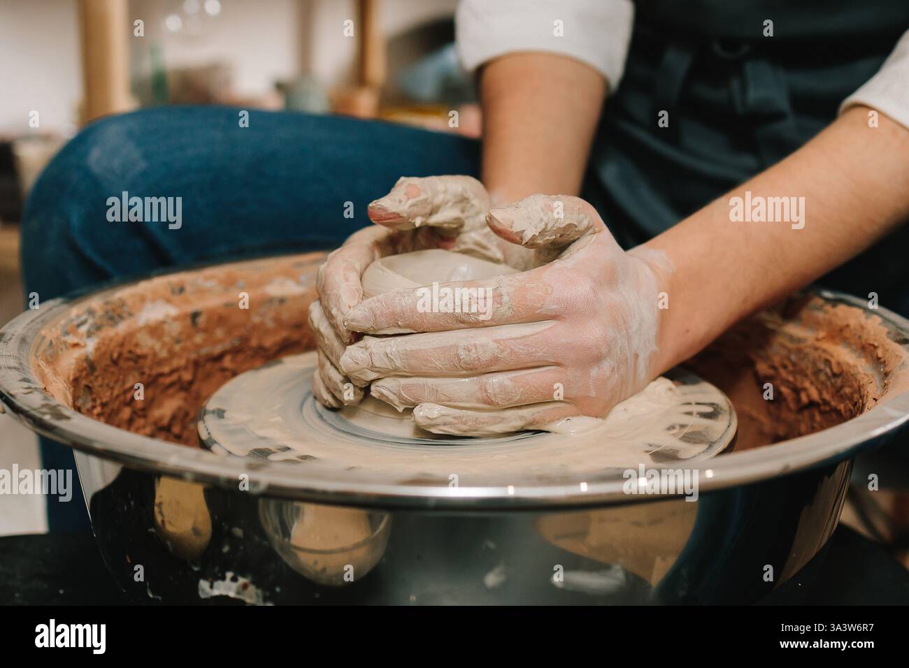 Process of making ceramic earthenware on the spinning wheel in the ...