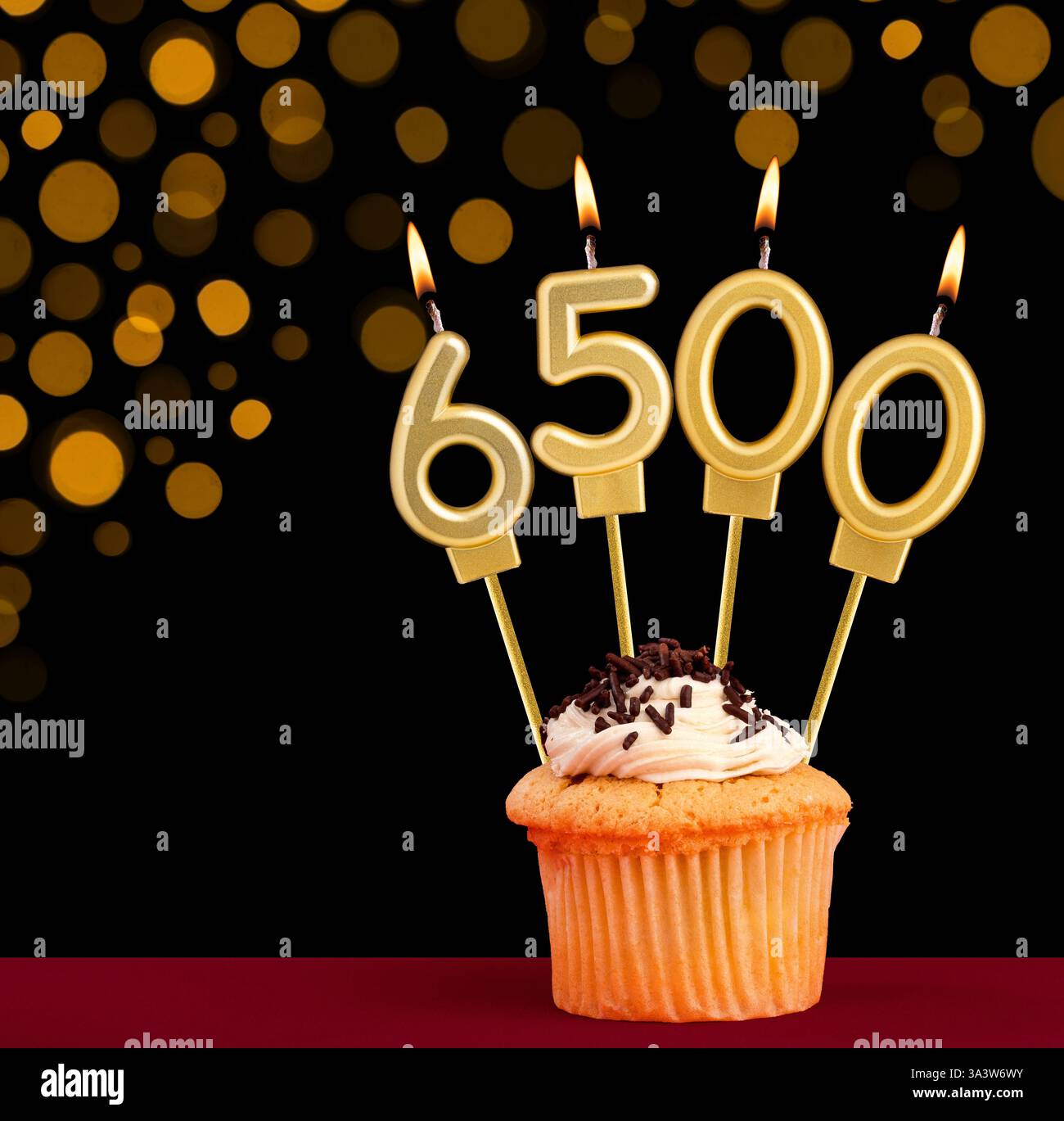 Birthday candle with cupcake - Number 6500 on black background with out ...