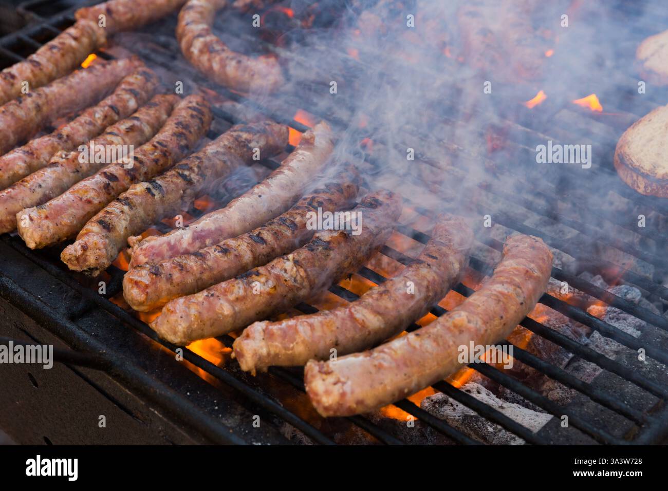 Sausages on grill Stock Photo - Alamy