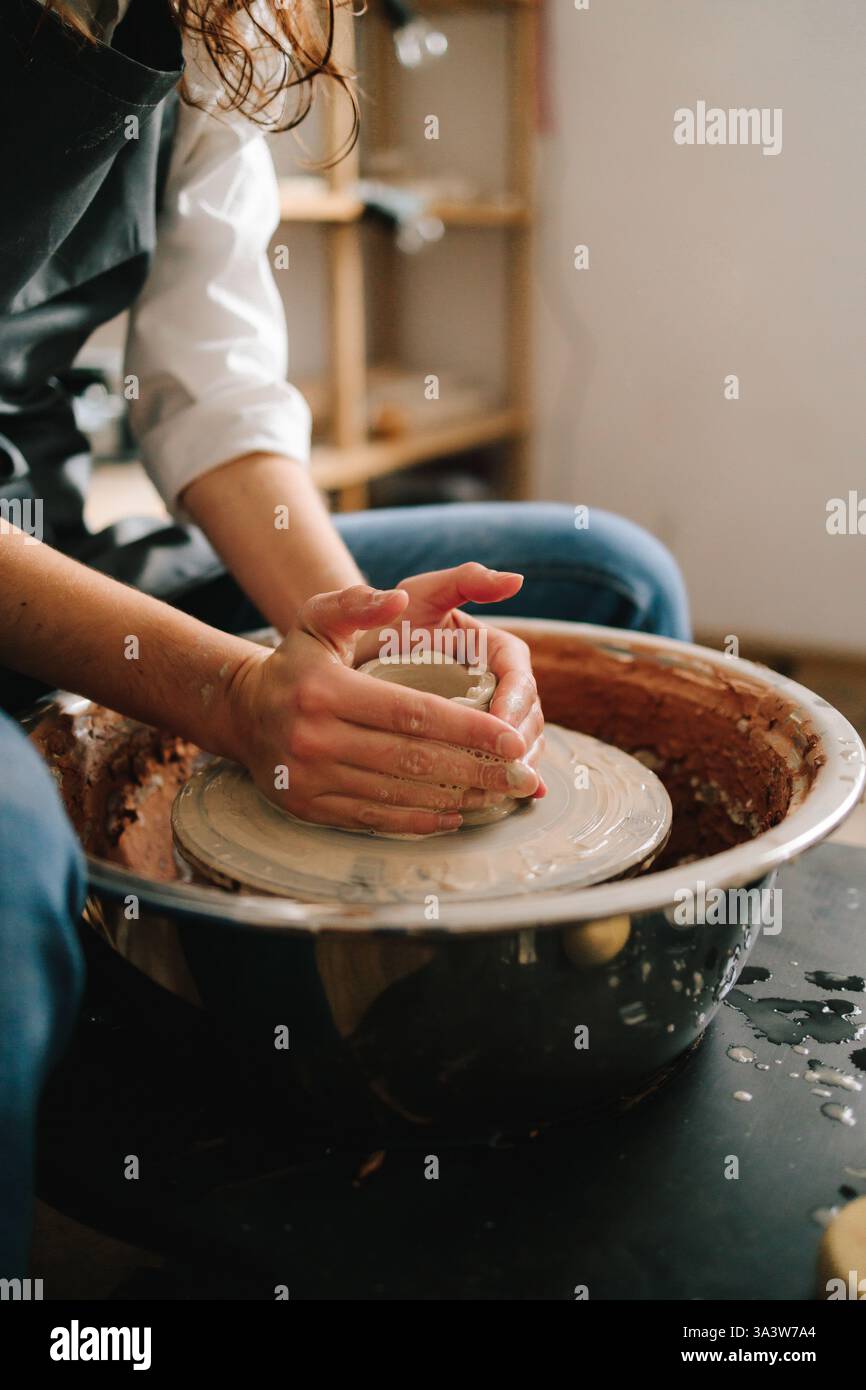 Potter creates a ceramic bowl in the pottery studio. Process of making ...
