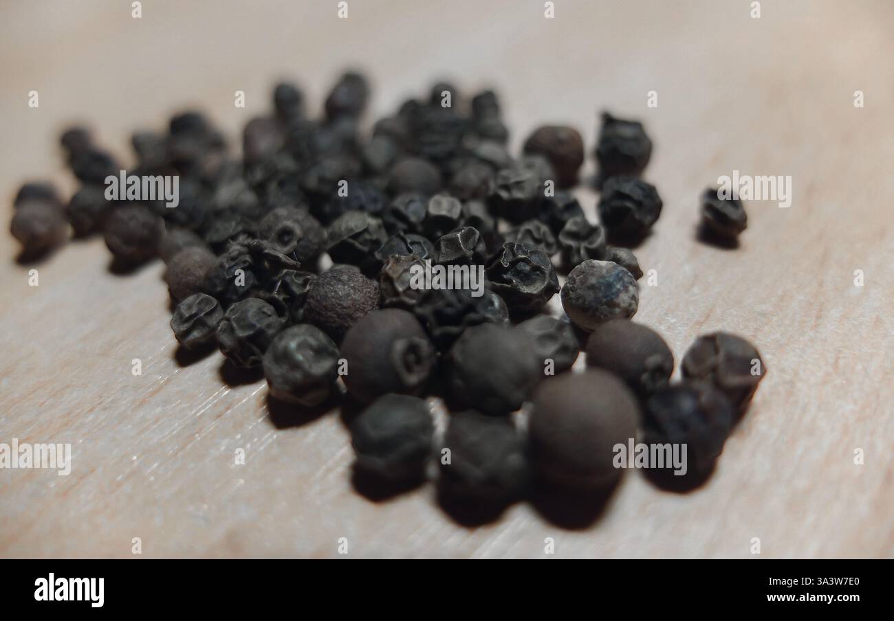 Black pepper zoomed in on and close up texture Stock Photo - Alamy