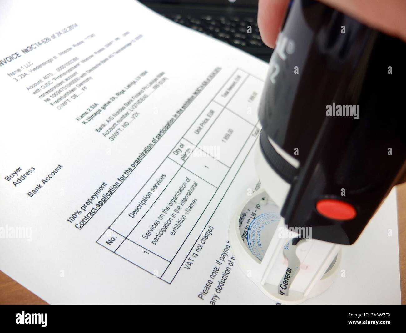 Close-up of a man putting a stamp on a document. Business concept Stock ...
