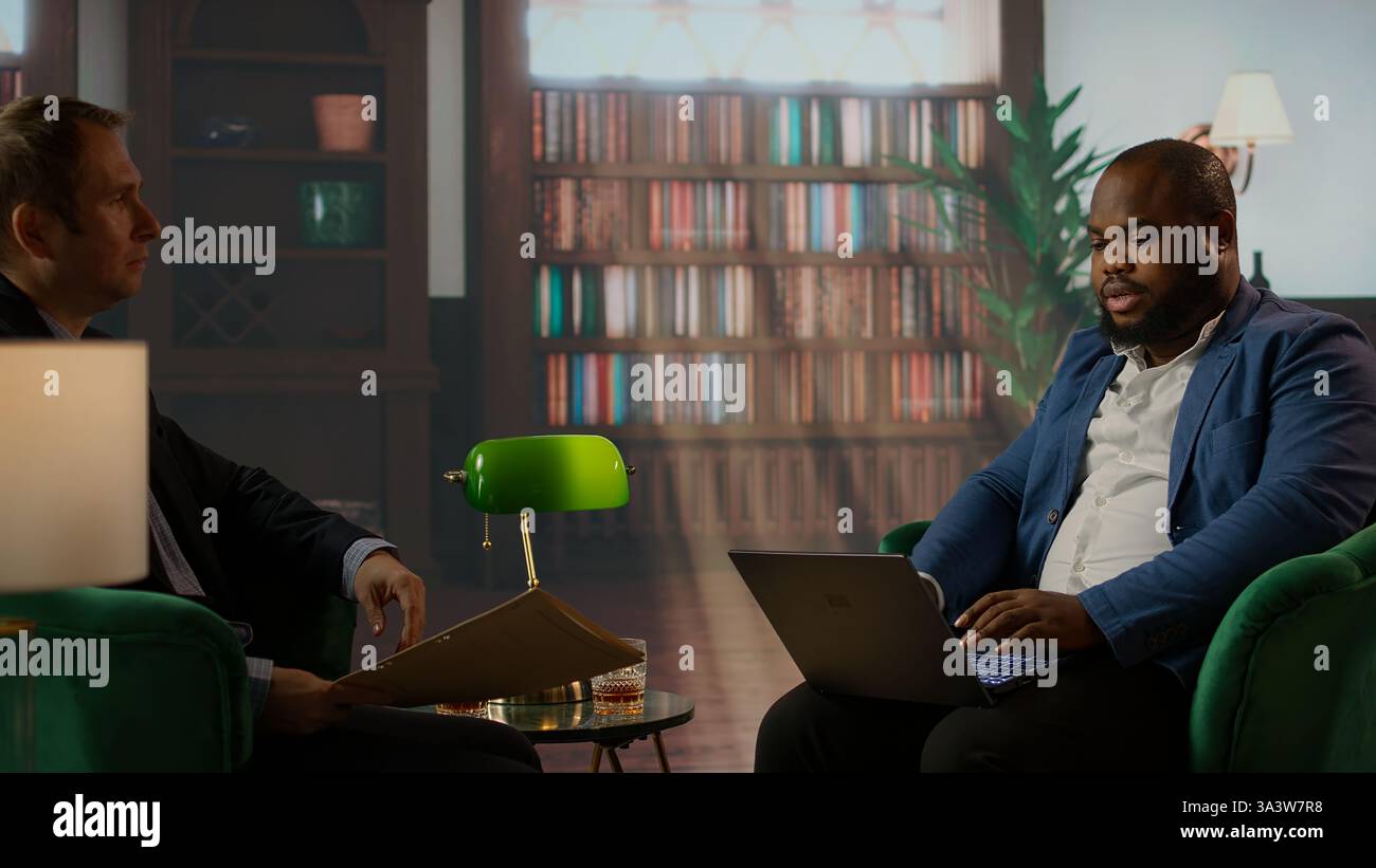 Diverse spies monitoring satellite surveillance data at headquarters ...