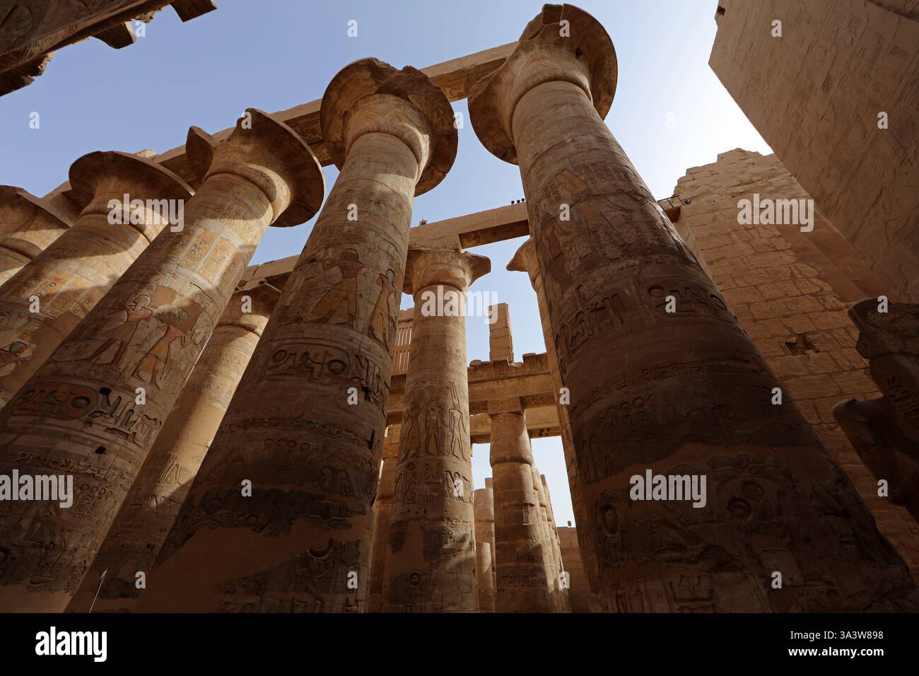 Massive columns with inscriptions and reliefs in the hypostyle hall in ...