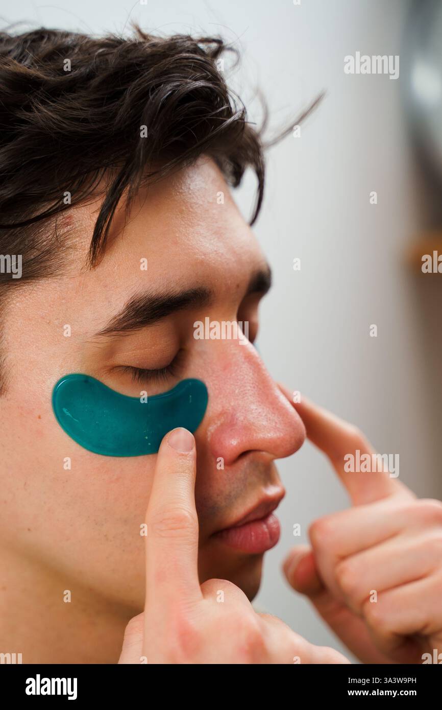 Man is relaxing during beauty routine and anti-aging treatment. Guy ...