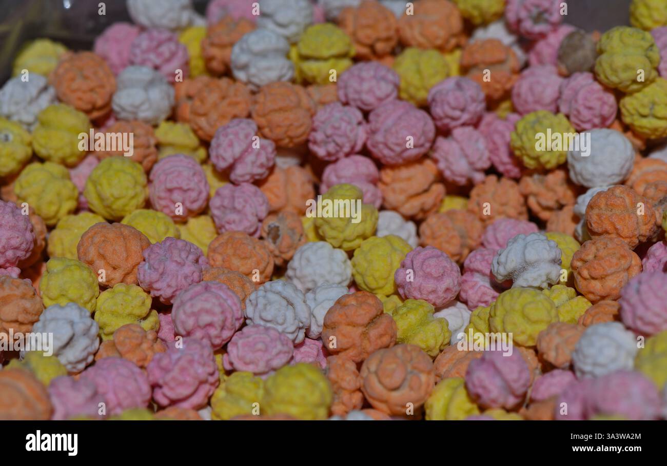 Delicate pastel candy pieces scatter joyfully, inviting smiles and ...