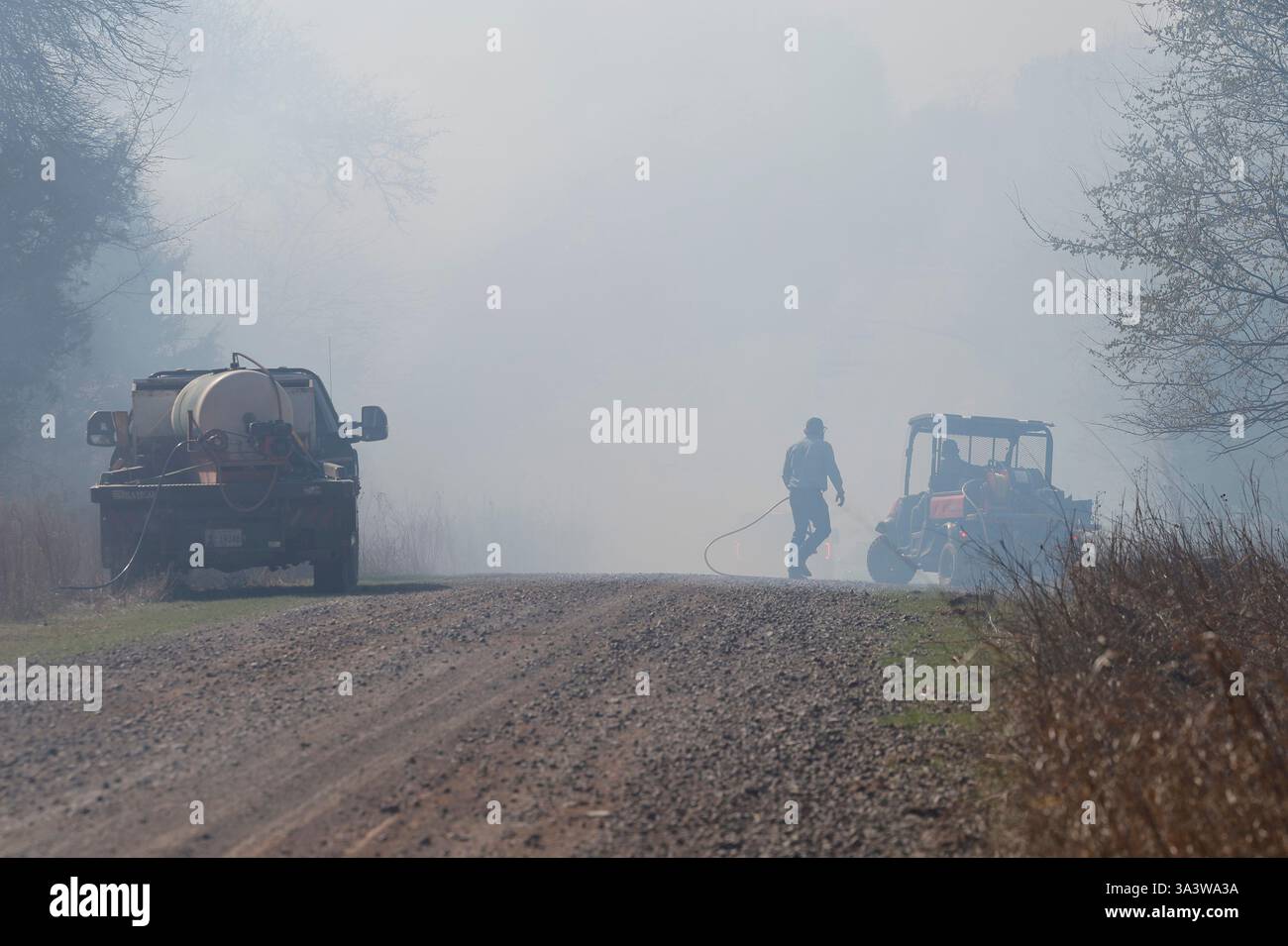 Fire crews and volunteers battle hot spots and new fires about several ...